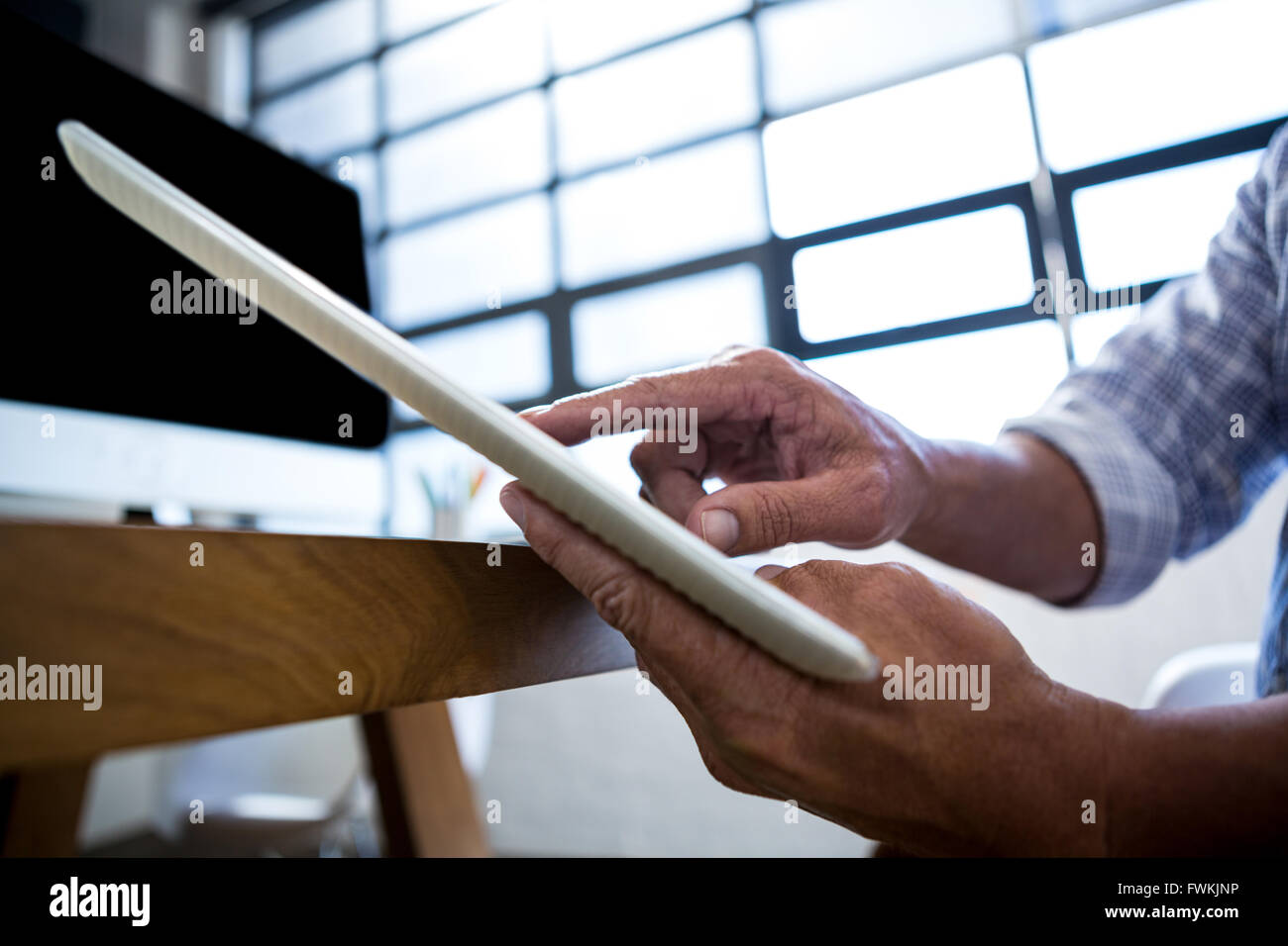 Man using digital tablet Stock Photo - Alamy