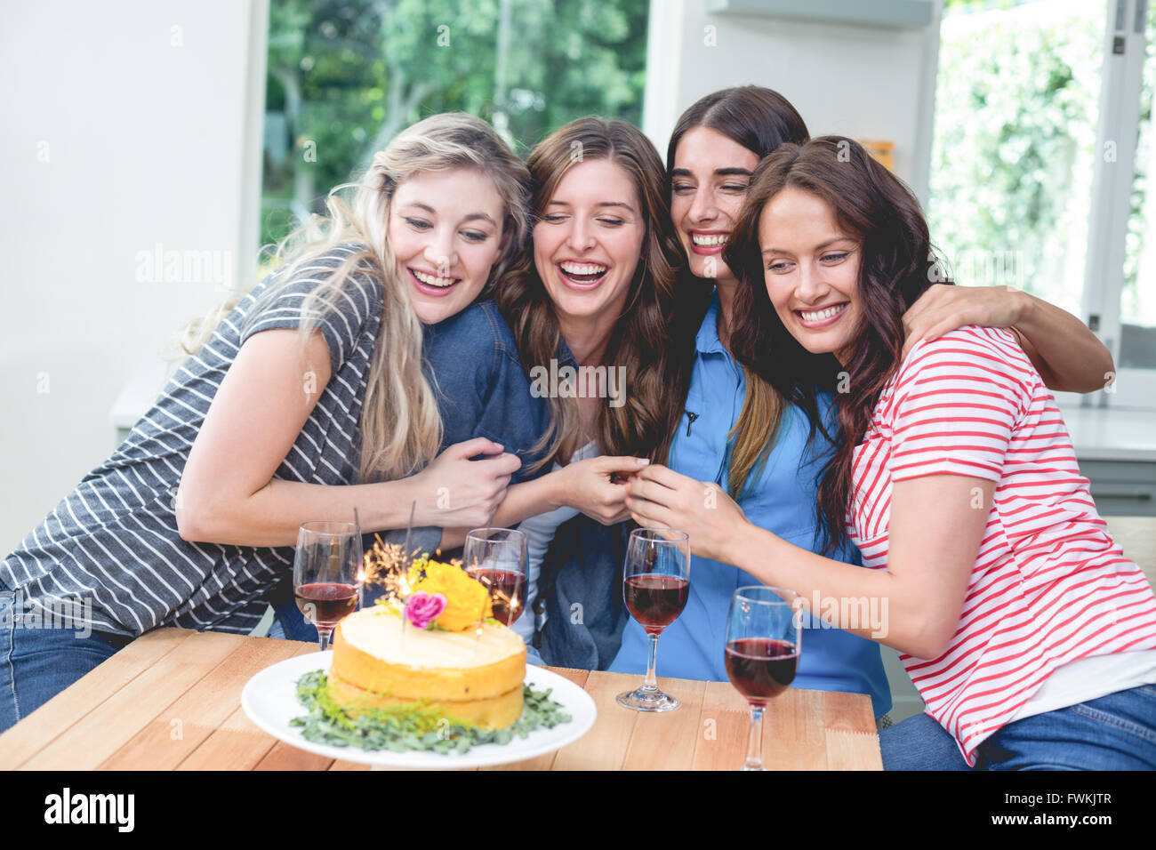 Happy friends celebrating a birthday together Stock Photo - Alamy