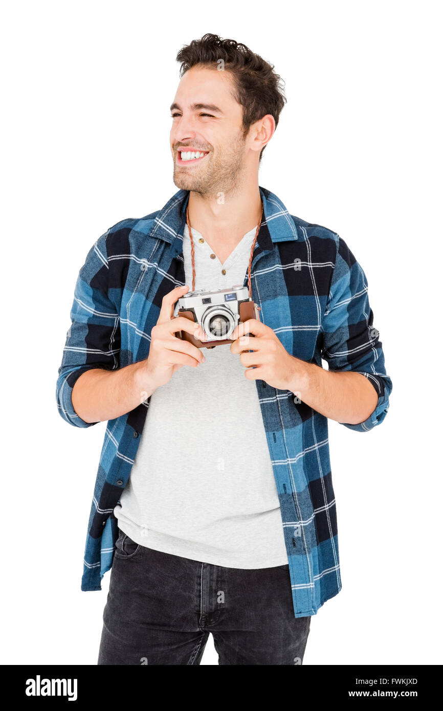Young man holding camera Stock Photo - Alamy