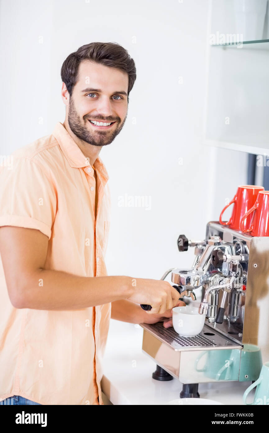 Man preparing coffee from coffeemaker Stock Photo - Alamy