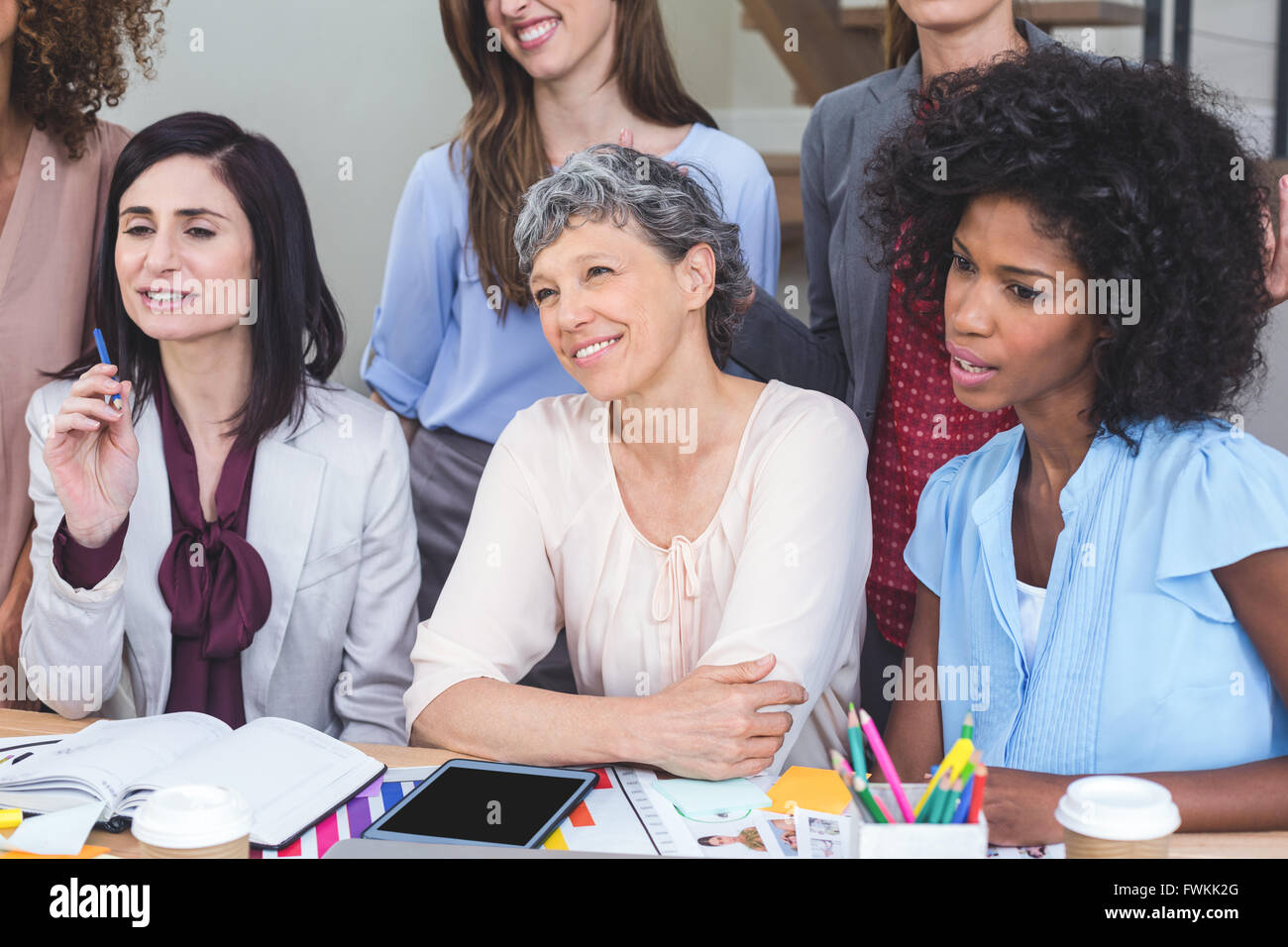 Group of interior designers listening to presentation Stock Photo - Alamy