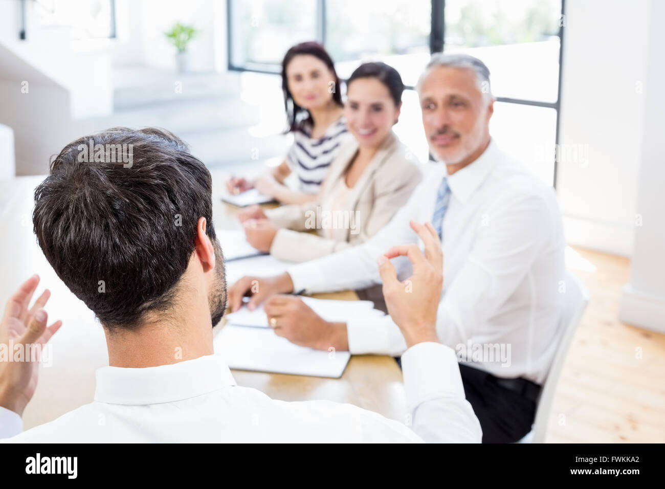 Male entrepreneur talking colleagues hi-res stock photography and ...