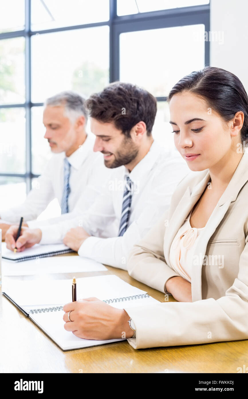 Business colleagues writing in hi-res stock photography and images - Alamy