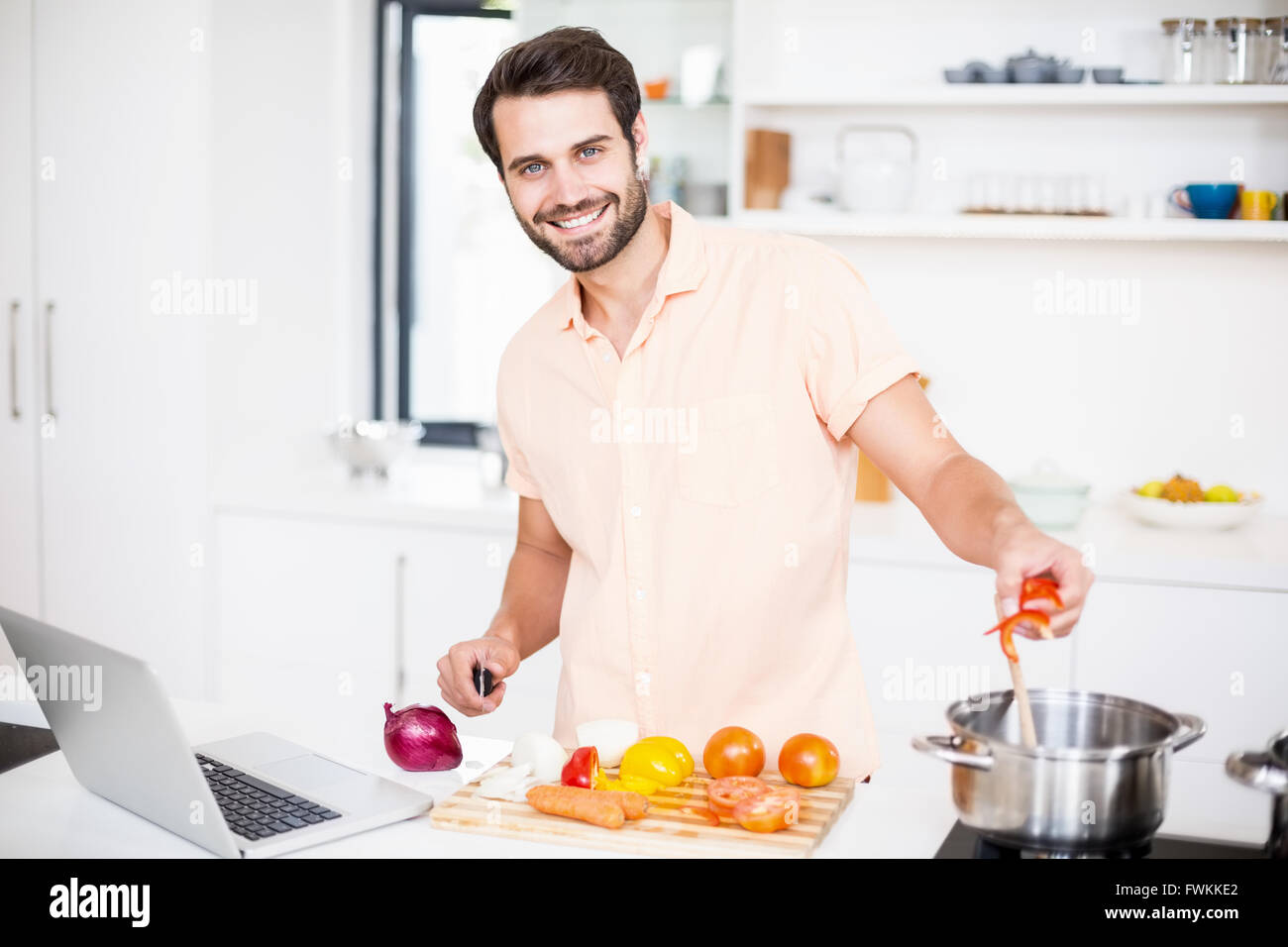 A Man is cooking food Stock Photo - Alamy