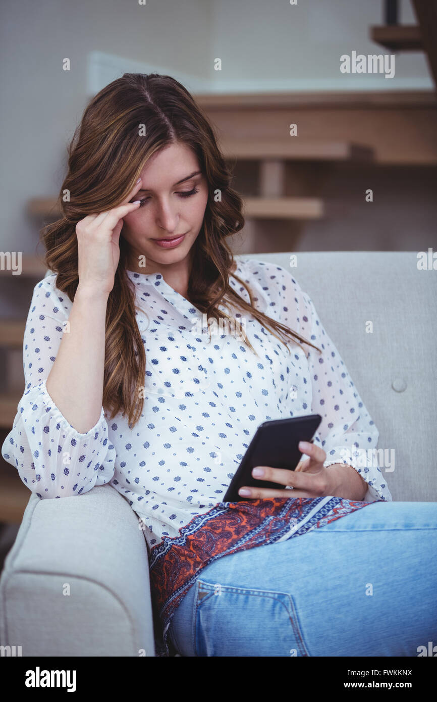Beautiful woman looking at her mobile phone Stock Photo - Alamy