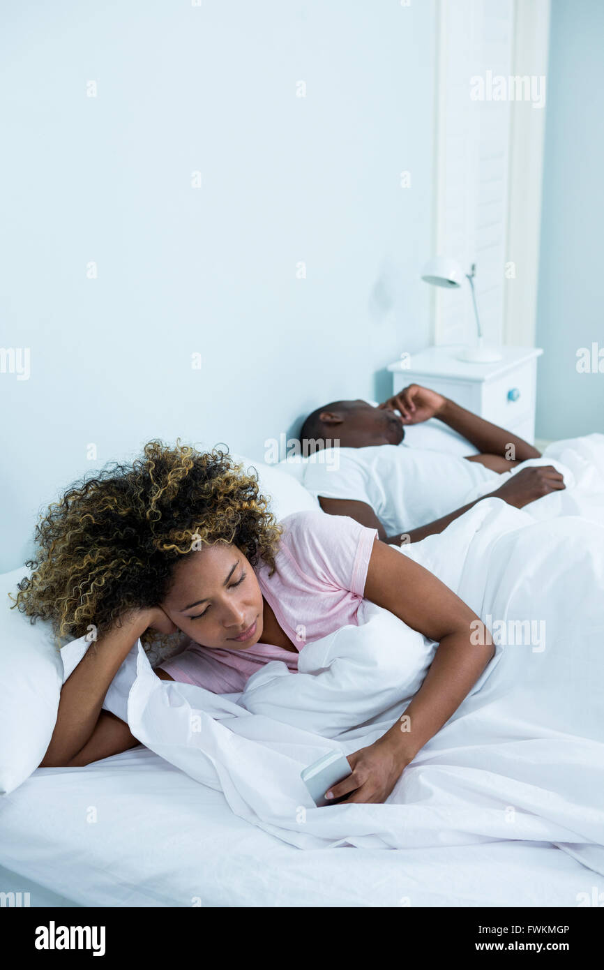 Tensed man leaning on wall Stock Photo - Alamy