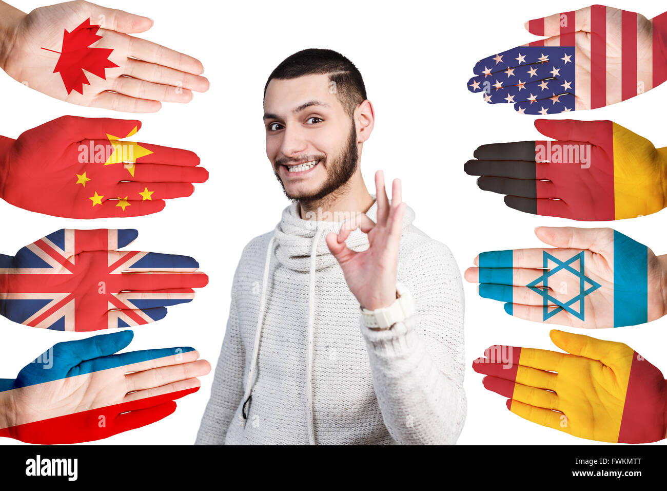 Young man and many hands with different country flags painted on them ...