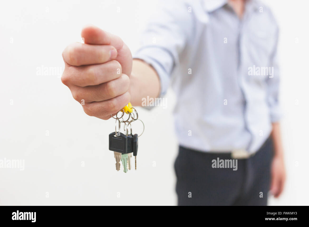 A man giving keys, vintage tone image Stock Photo - Alamy