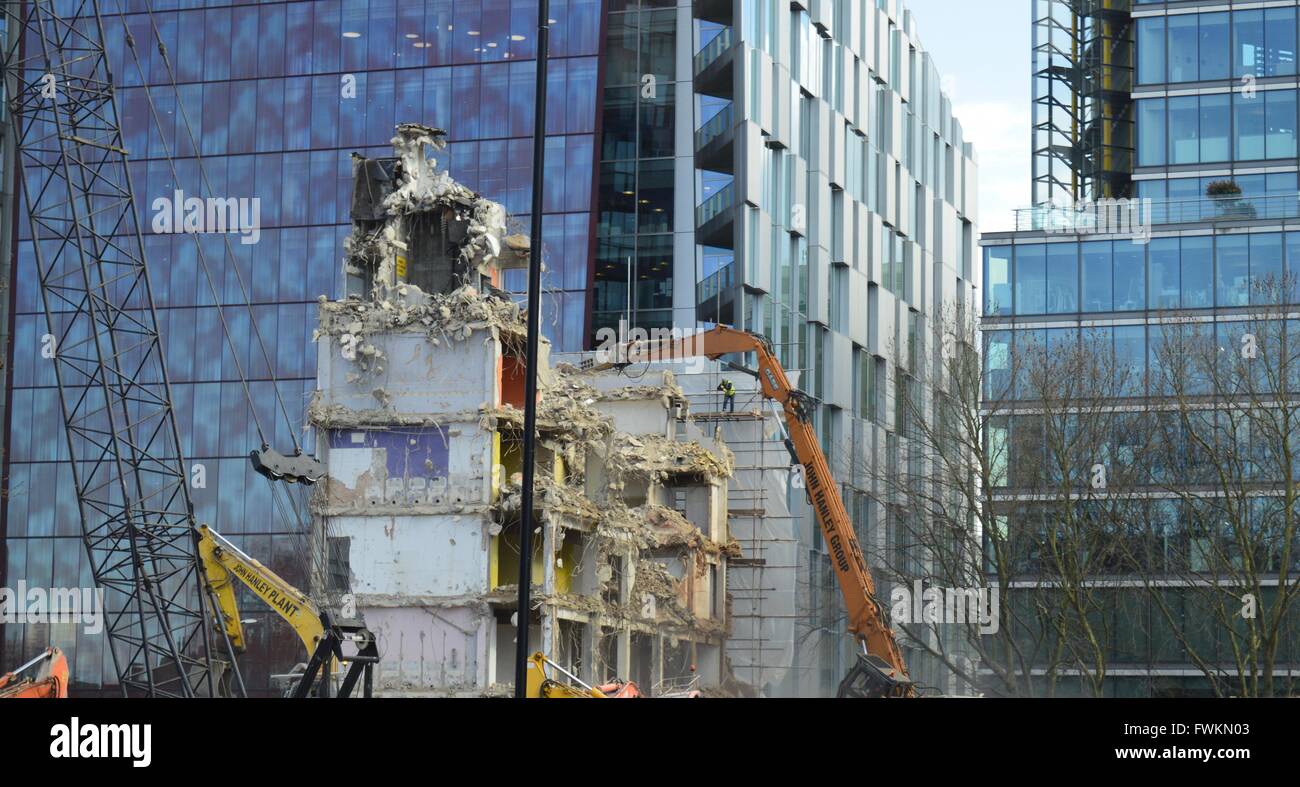 Demolition of an old London building with contrasting new buildings ...