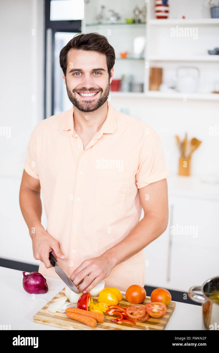 Man chopping vegetables Stock Photo - Alamy