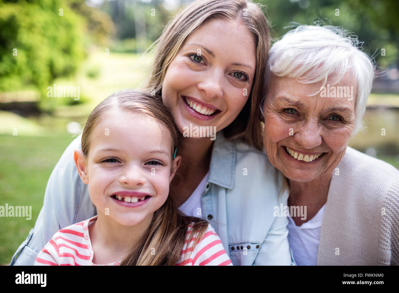Portrait of multi-generation family smiling Stock Photo - Alamy