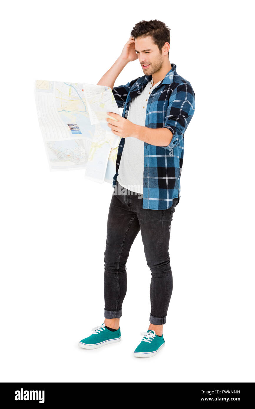 Young man looking at map Stock Photo - Alamy