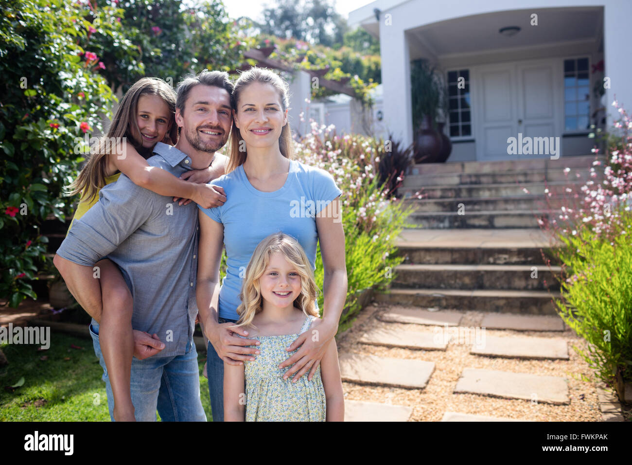 Portrait of family standing together Stock Photo - Alamy