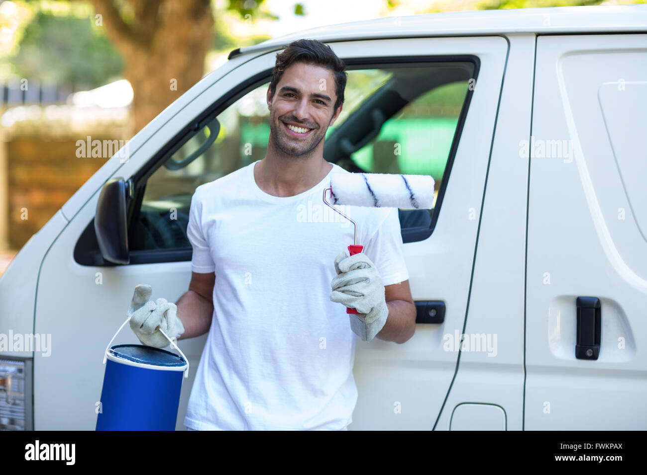 Portrait of confident painter with equipment Stock Photo - Alamy