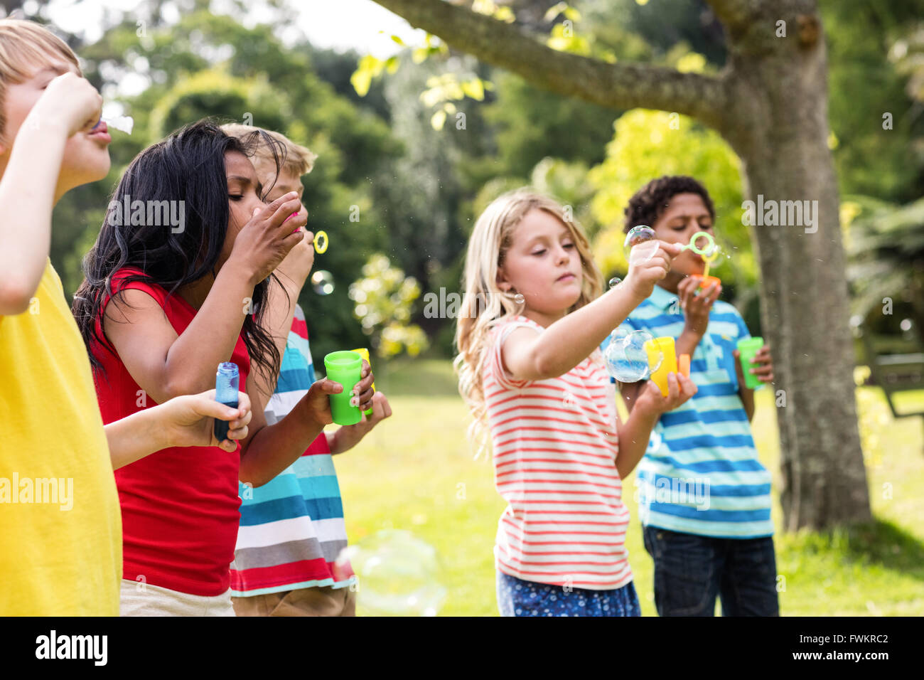 Boy girl blowing soap bubbles hi-res stock photography and images - Alamy
