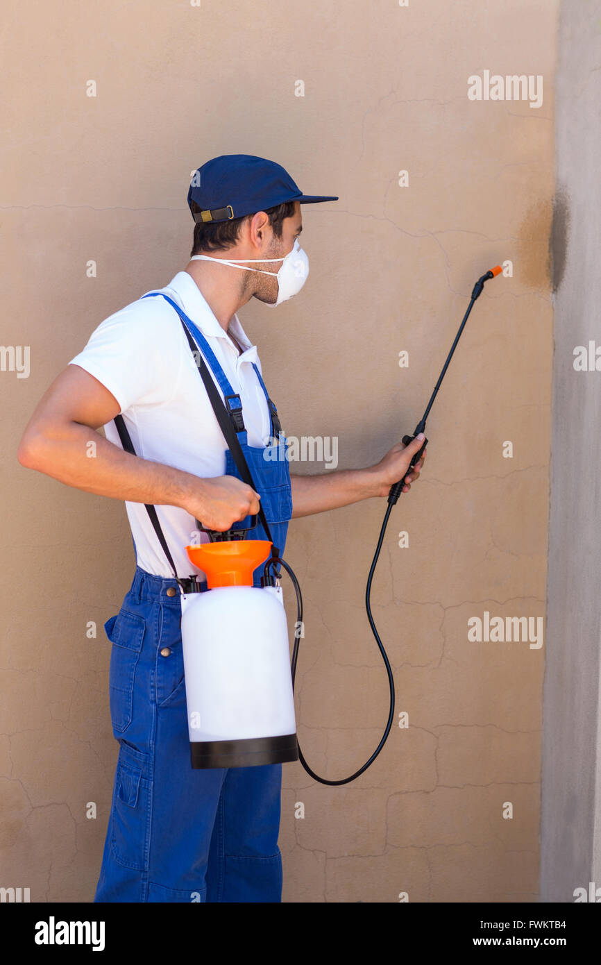 Young man spraying pesticide hi-res stock photography and images - Alamy