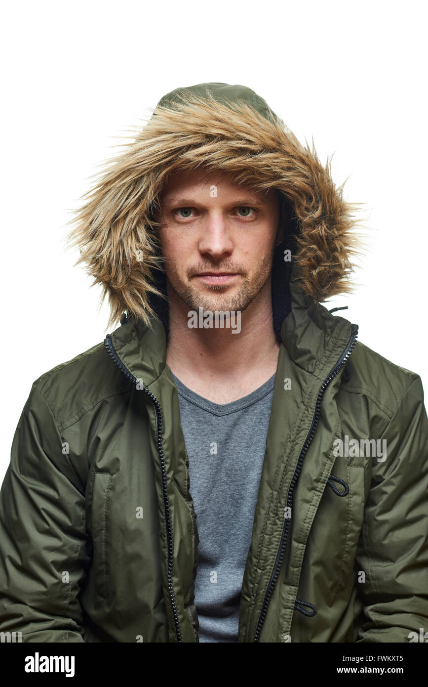 High key studio portrait of young adult caucasian model wearing winter ...