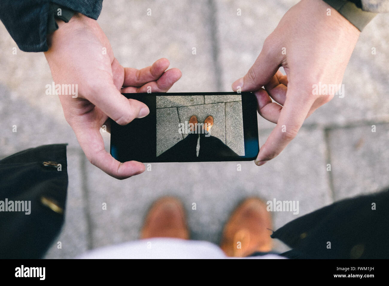 Man hands on legs hi-res stock photography and images - Alamy