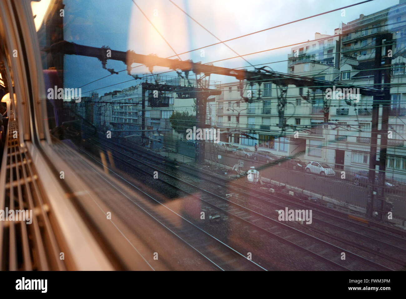 Buildings In City Seen Through Train Window Stock Photo - Alamy