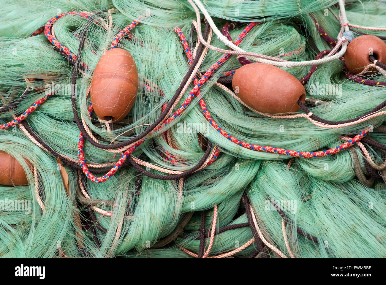 Detail of fishing nets piled up Stock Photo - Alamy