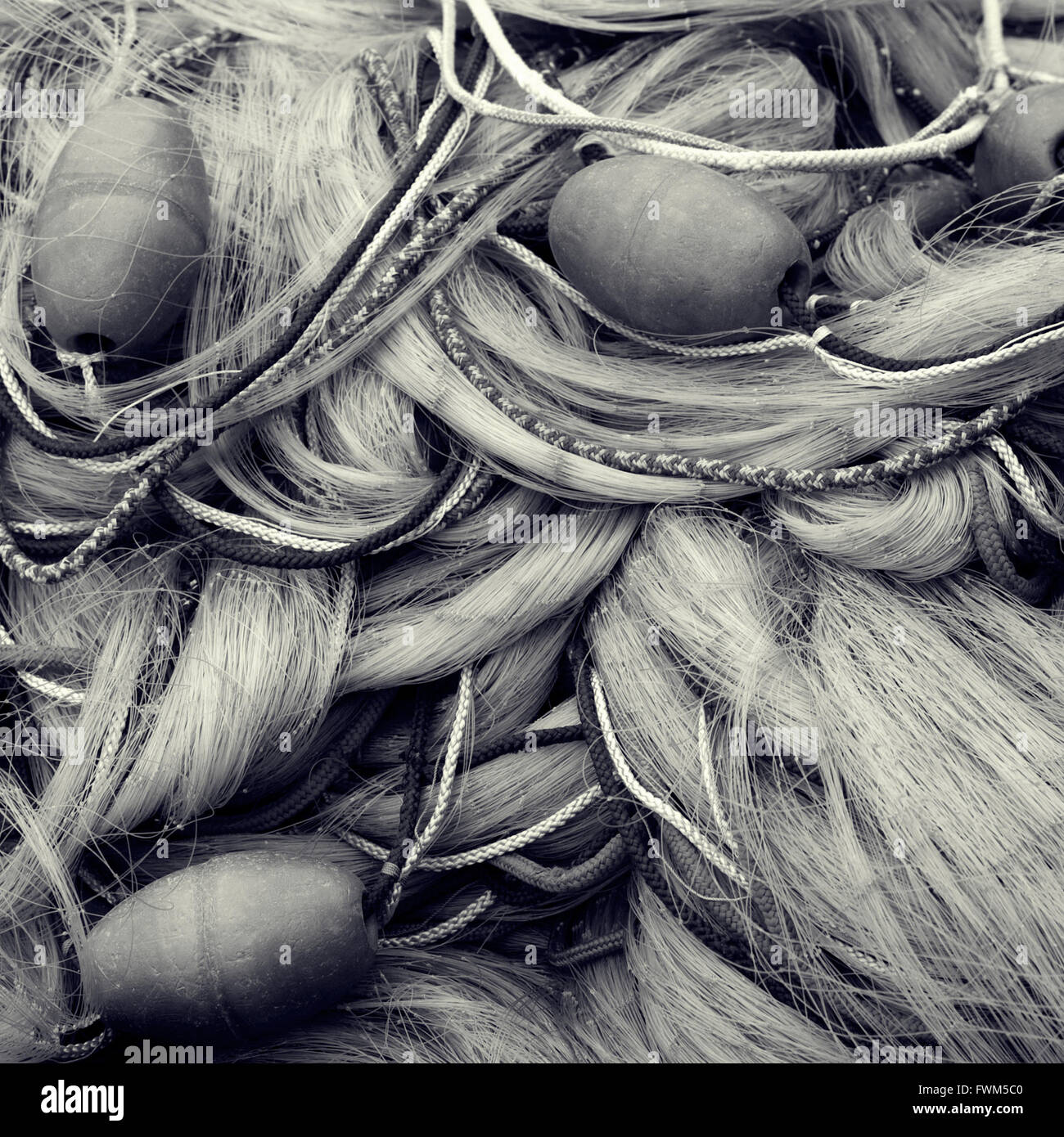 Detail of fishing nets piled up Stock Photo - Alamy