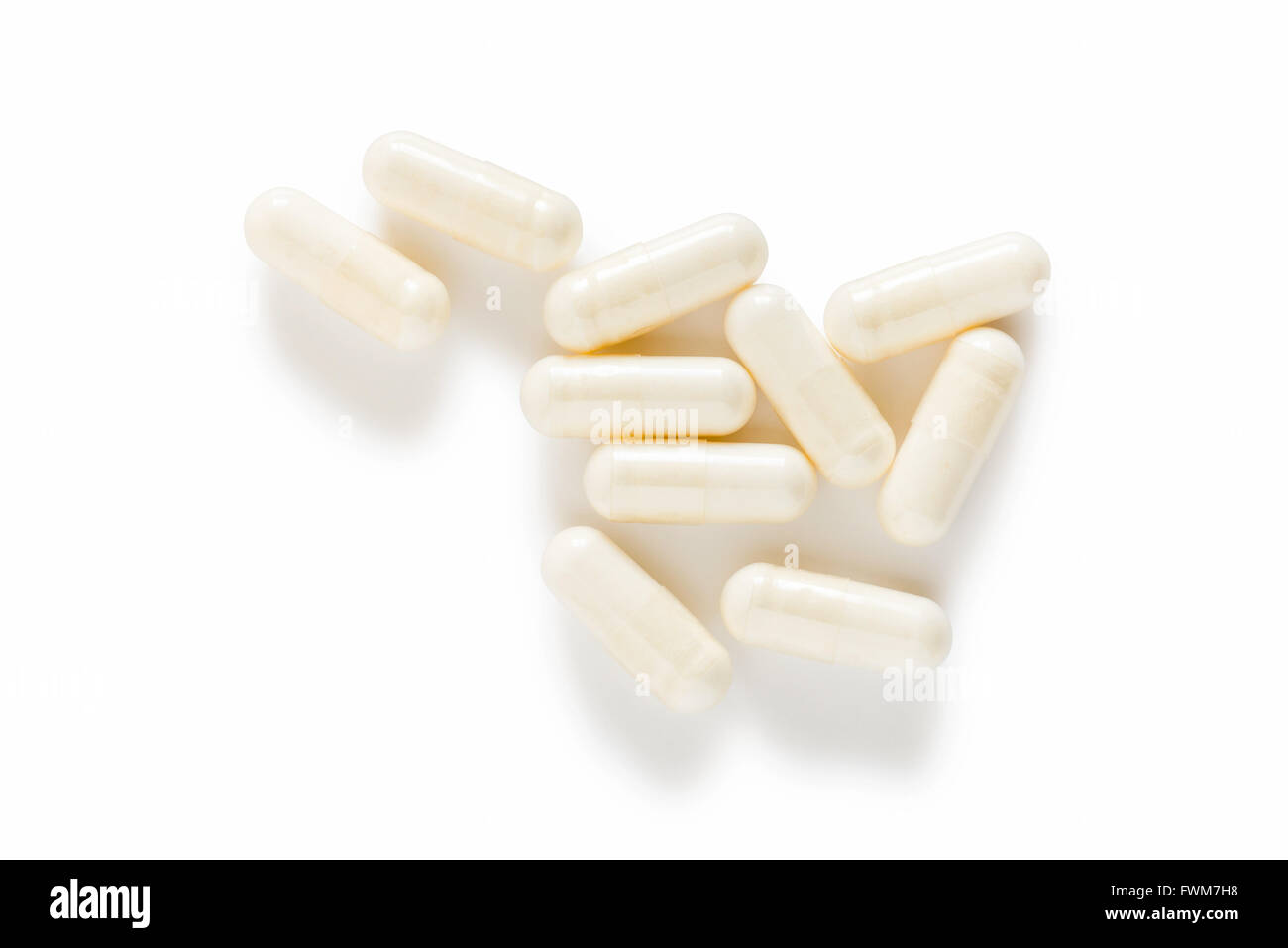 Ten yoghurt capsules isolated on a white background. Yoghurt Capsules ...