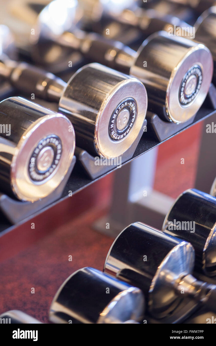 small dumbbell weights in personal gym Stock Photo - Alamy