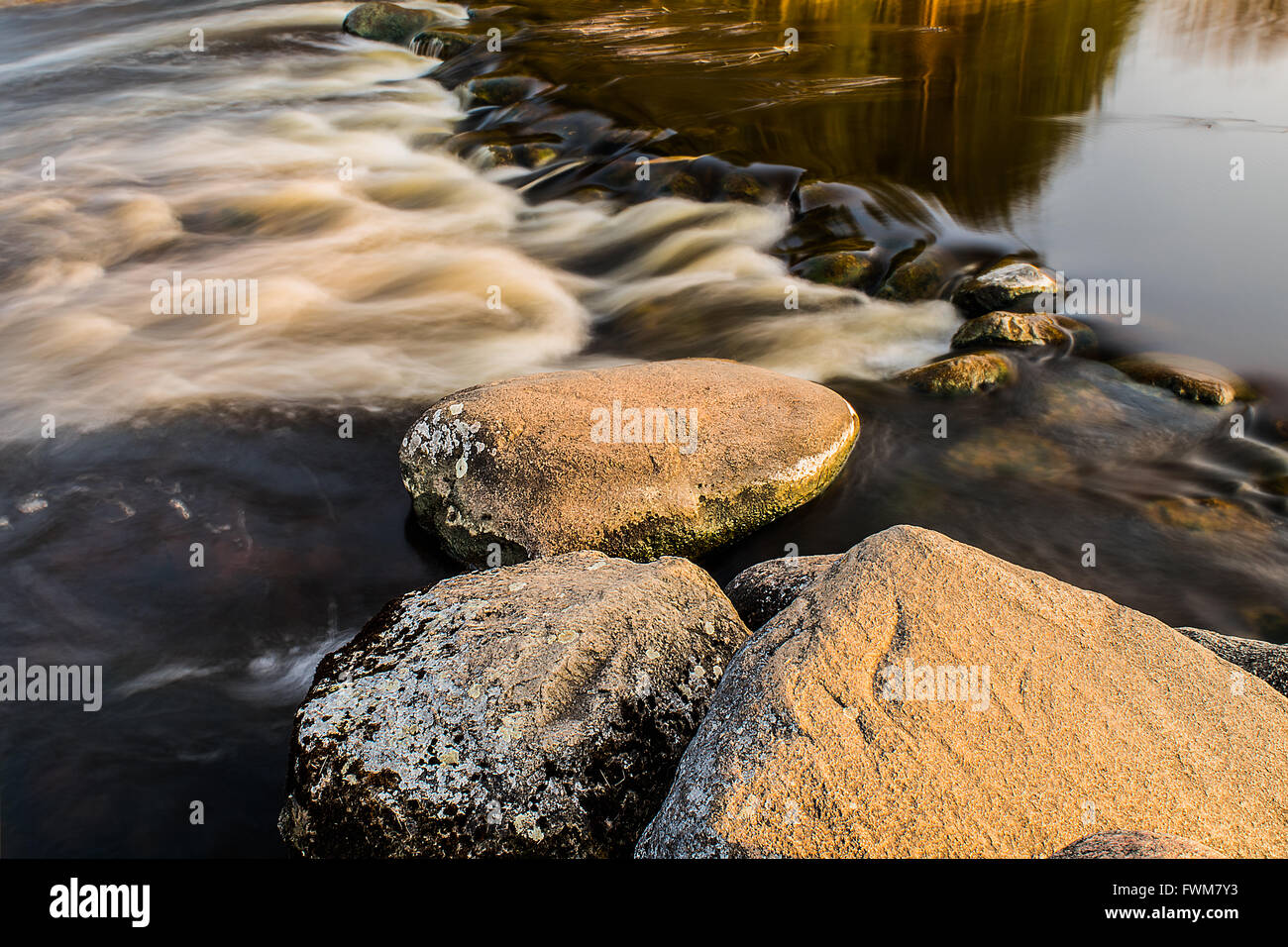 Water flow through the stones Stock Photo - Alamy