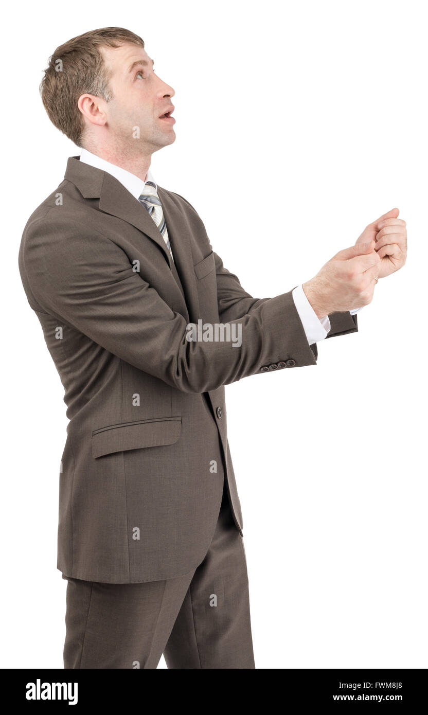 Businessman holding hands in front of him Stock Photo - Alamy