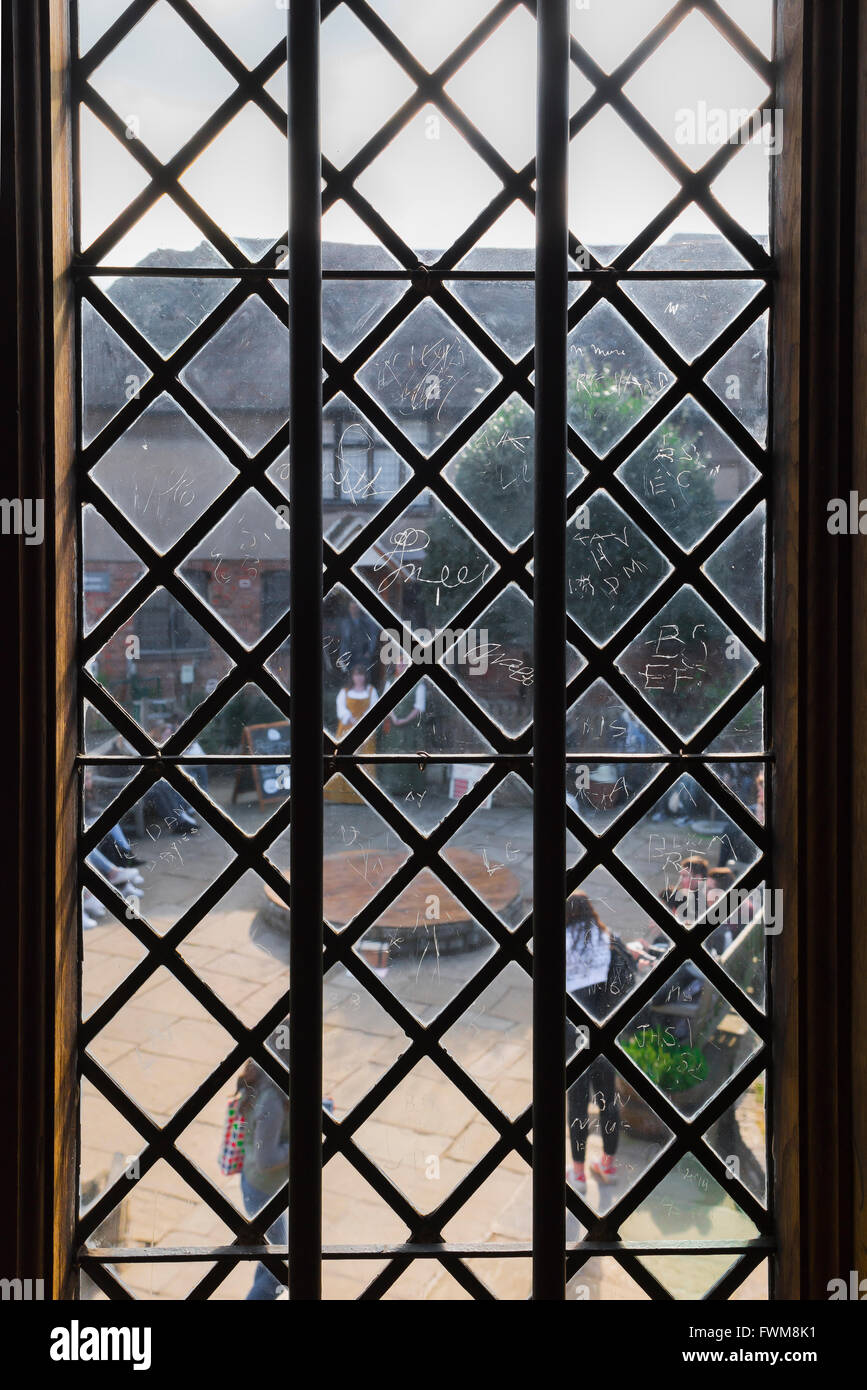 Medieval leaded glass window bearing names scratched into its glass in ...
