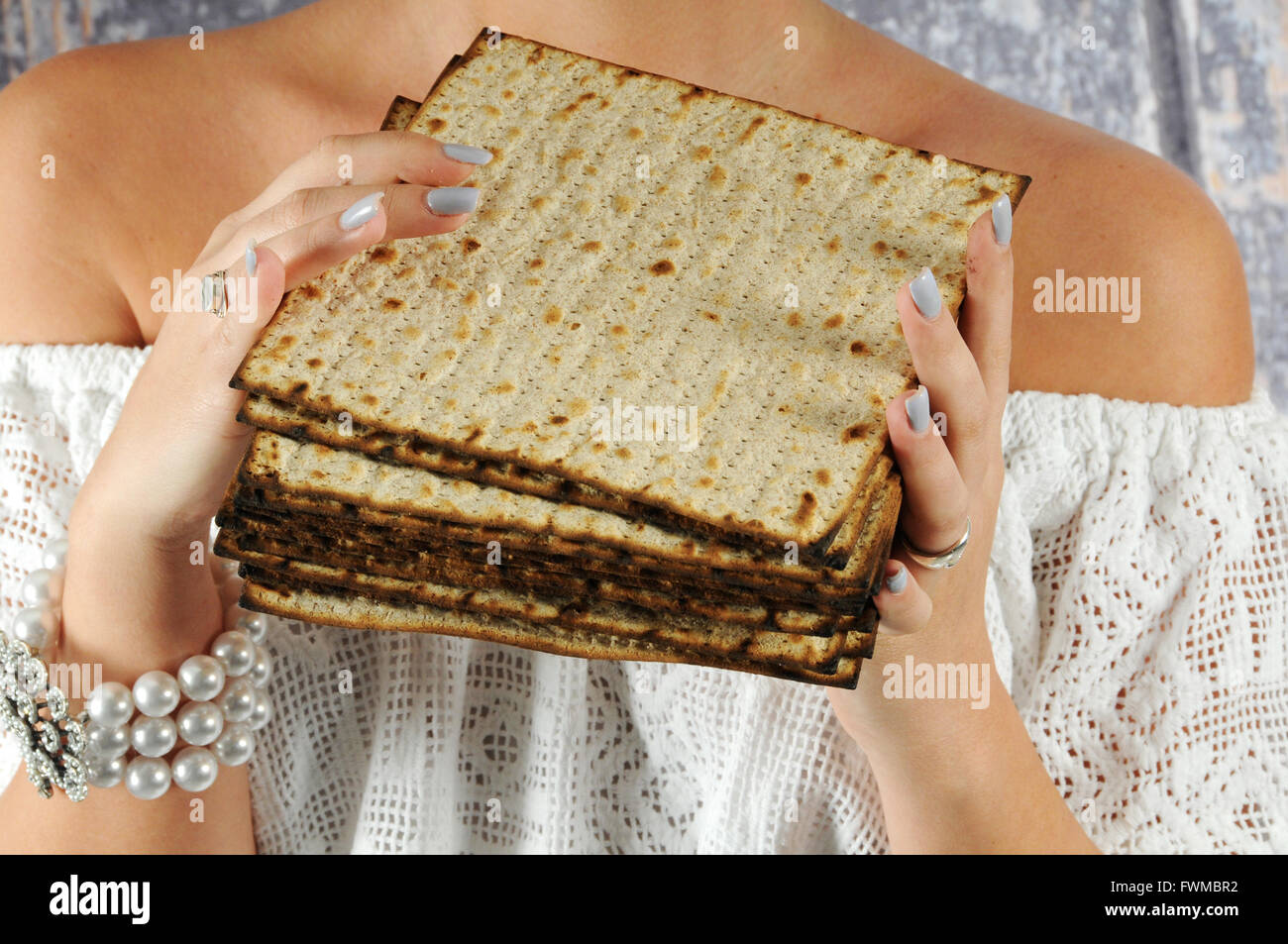 Passover - hands holding group of Passover matzos Stock Photo - Alamy