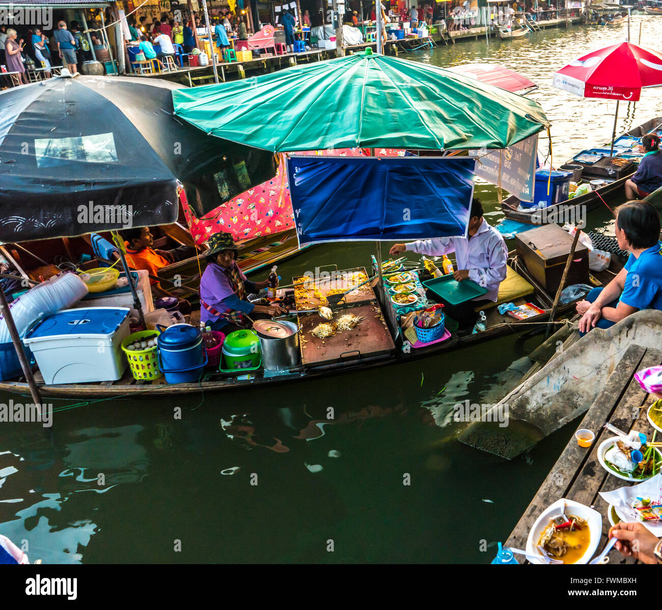 Trader's boats in a floating market in Thailand Stock Photo - Alamy