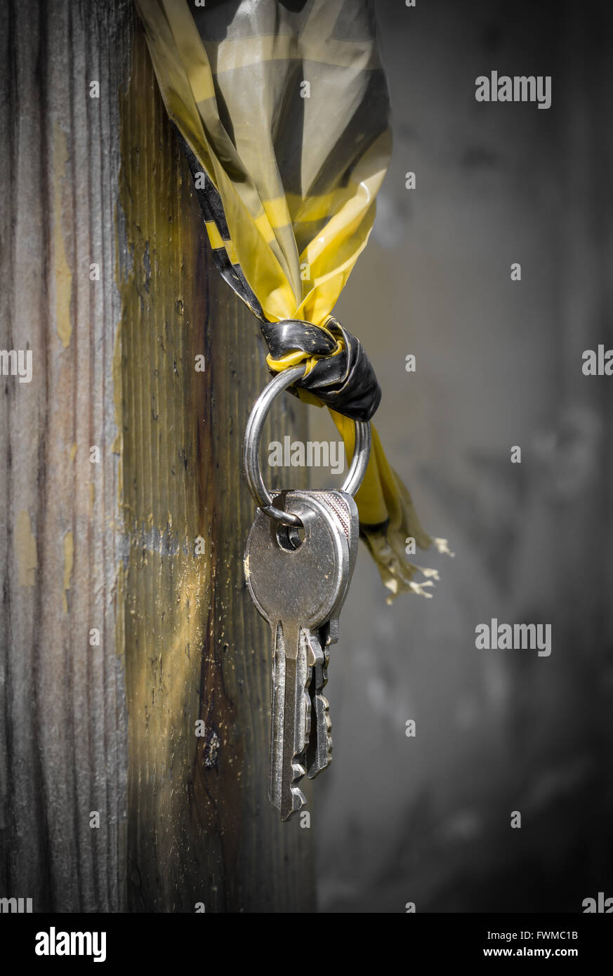 Metal keys hanging from a wooden pole Stock Photo - Alamy