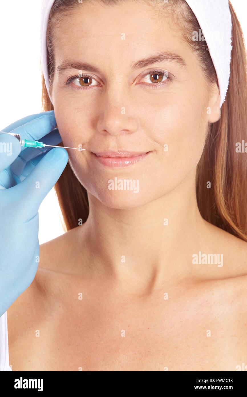 Attractive elderly woman getting plastic surgery with syringe Stock ...