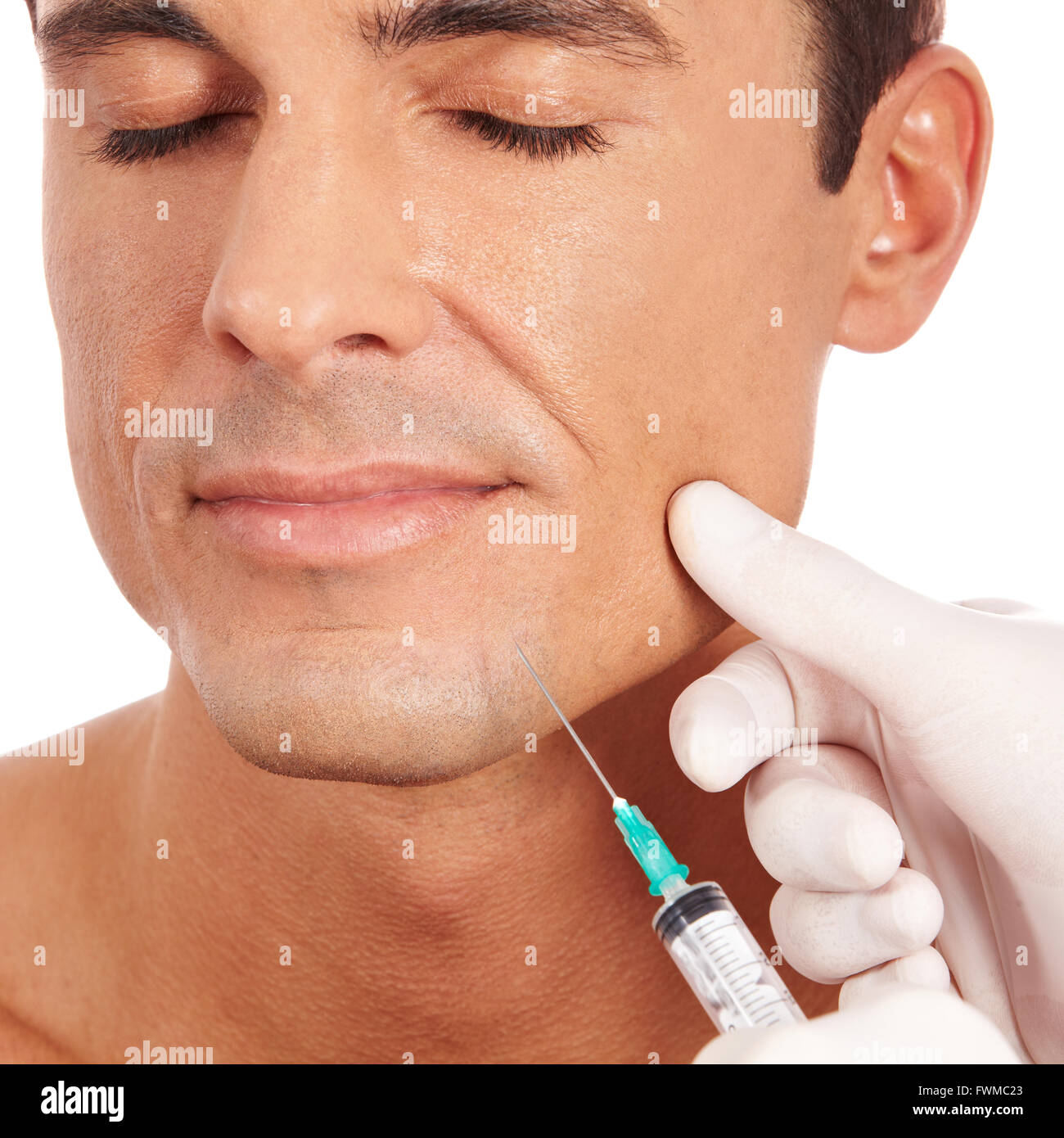 Attractive man at plastic surgery with syringe in his face Stock Photo ...