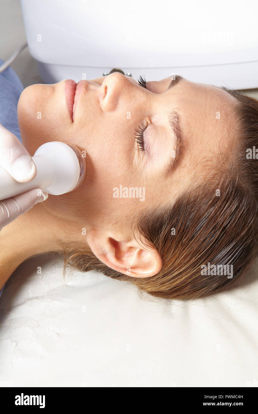 Woman getting high frequency skin treatment in spa Stock Photo - Alamy