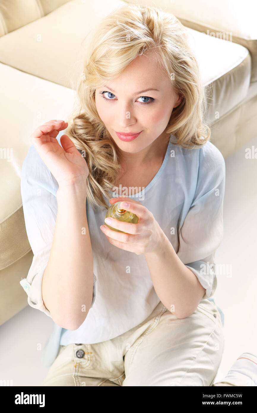 Beautiful smell- woman test perfume on her wrist. Sensual perfume ...