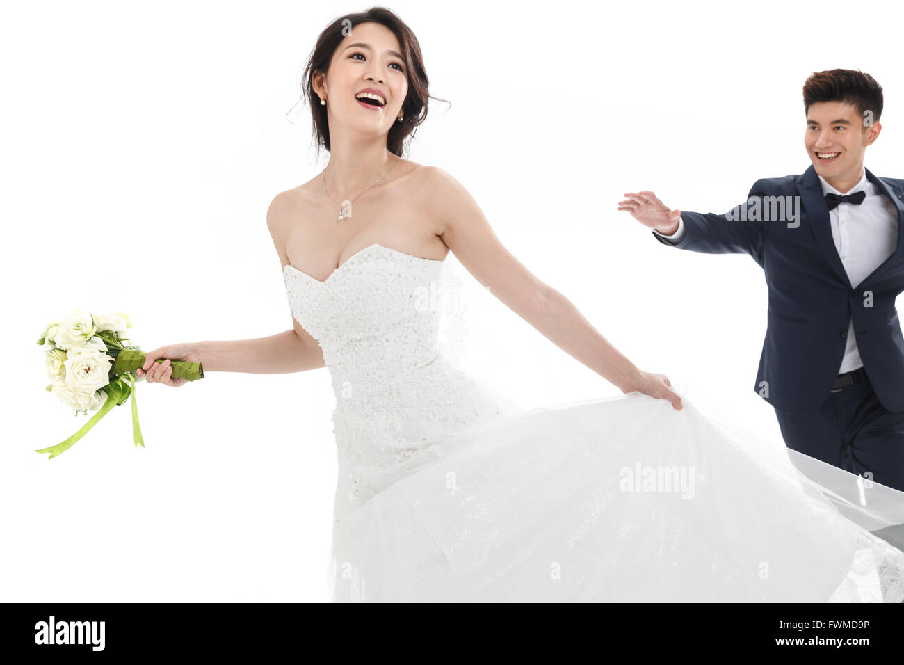 Groom chasing bride hi-res stock photography and images - Alamy