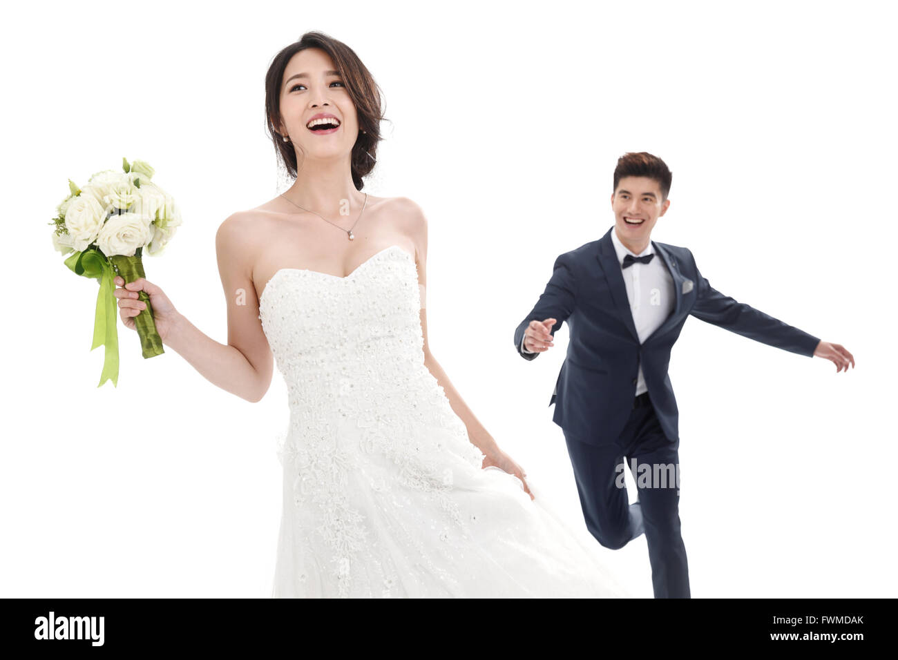Groom chasing bride hi-res stock photography and images - Alamy