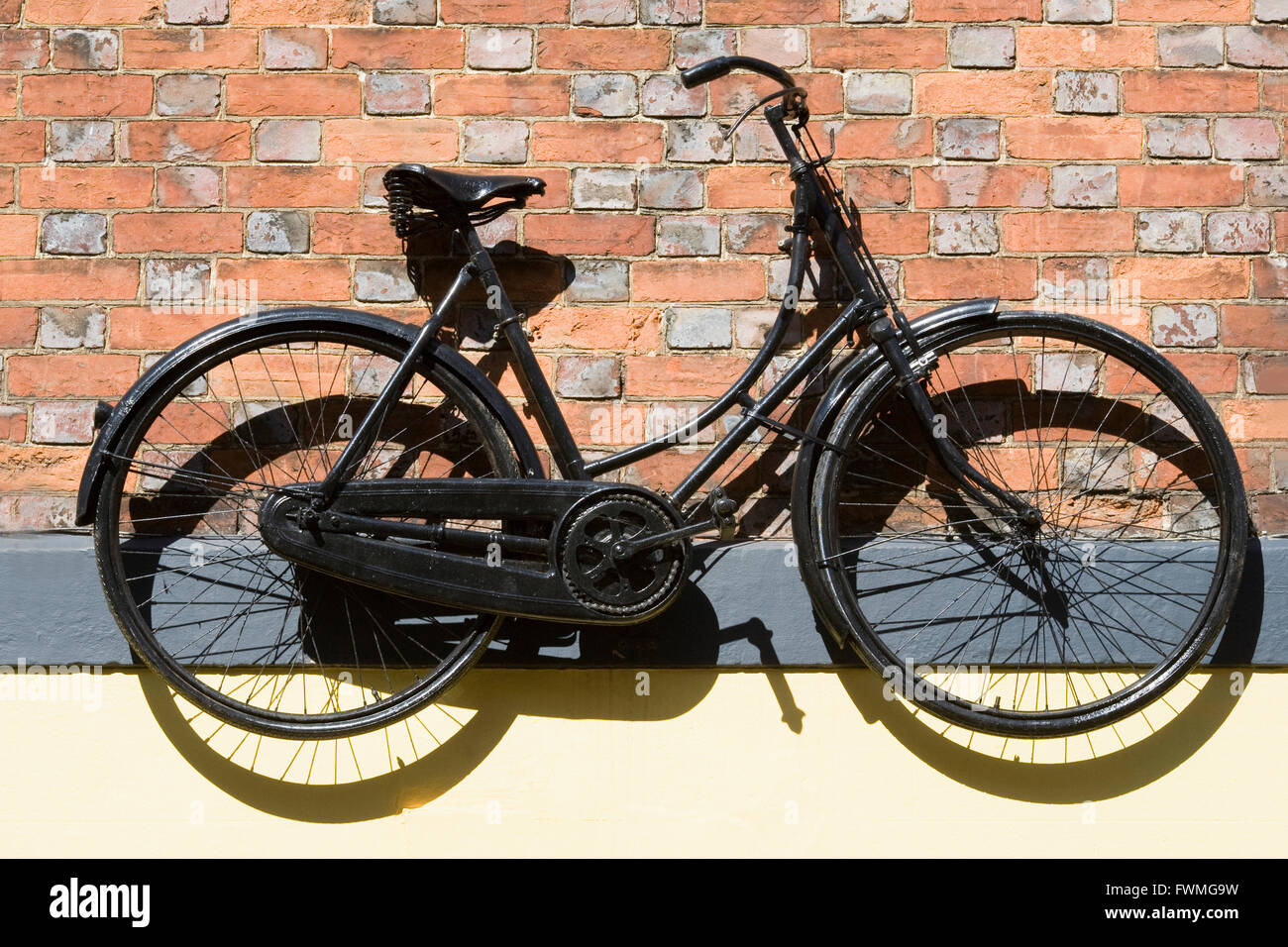 Old Bicycle attached to a brick wall, Oxford Stock Photo - Alamy