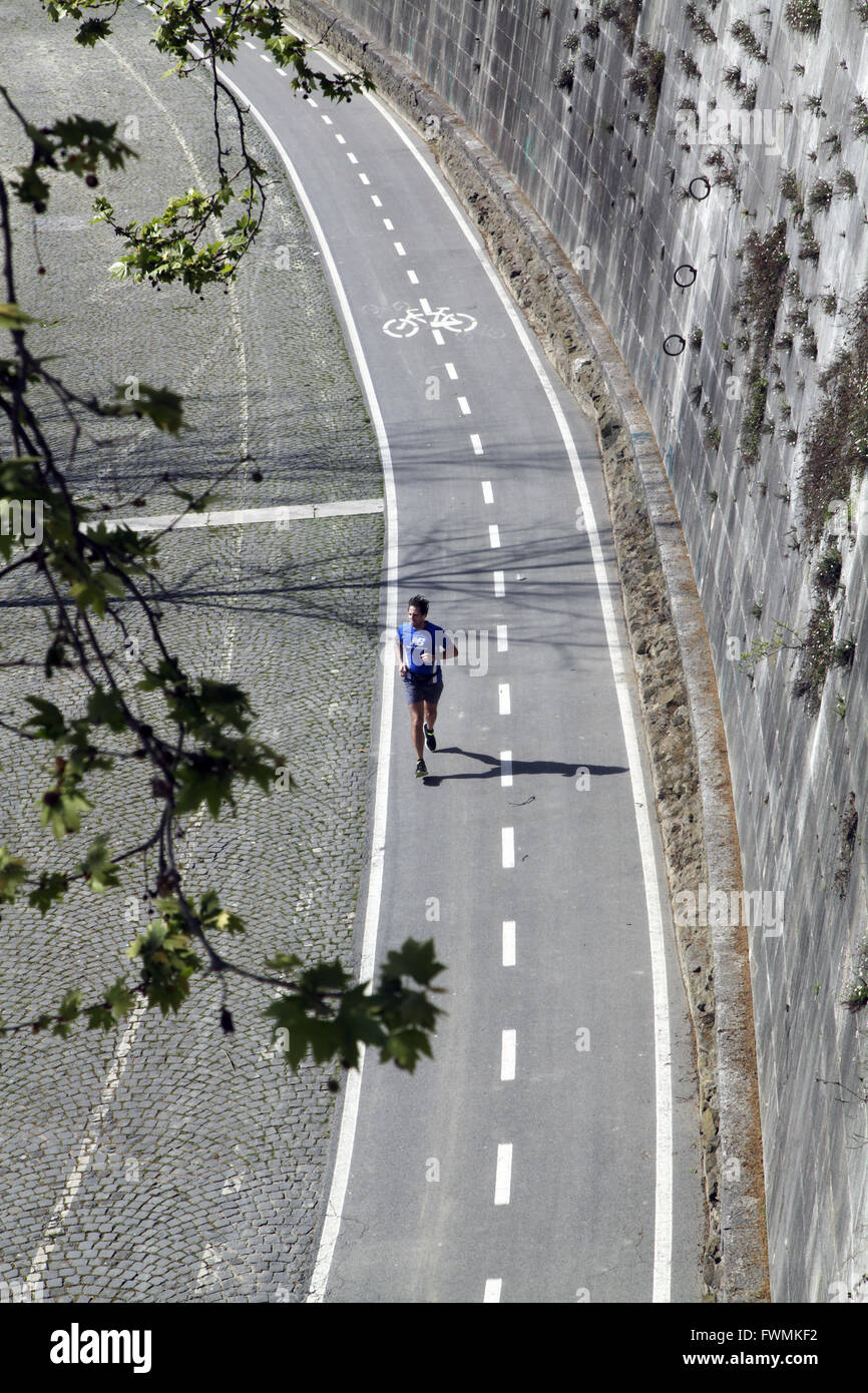 runner on running track alongside of Tevere river in Rome, Italy Stock ...