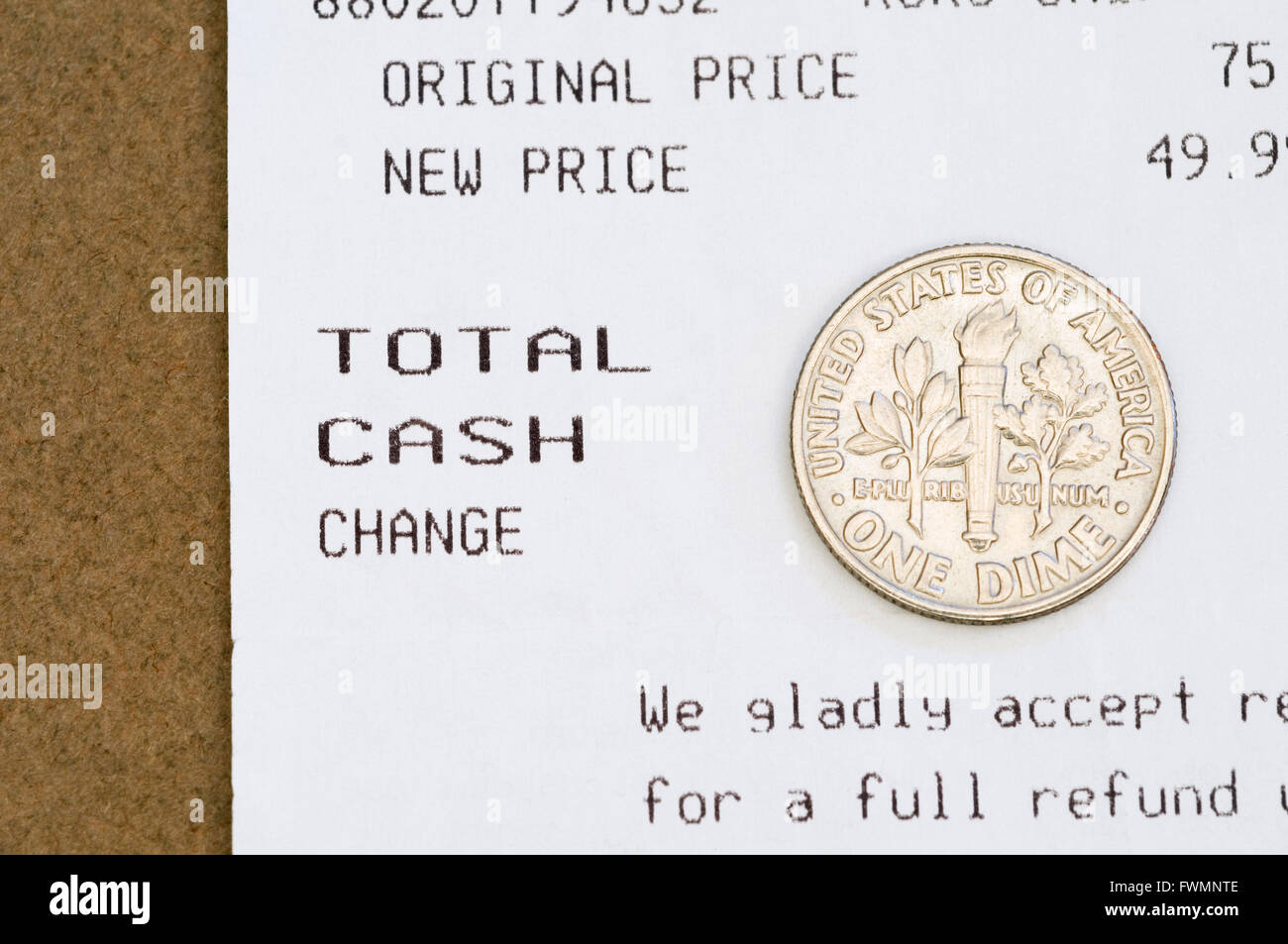 a one dime coin on a till receipt Stock Photo - Alamy