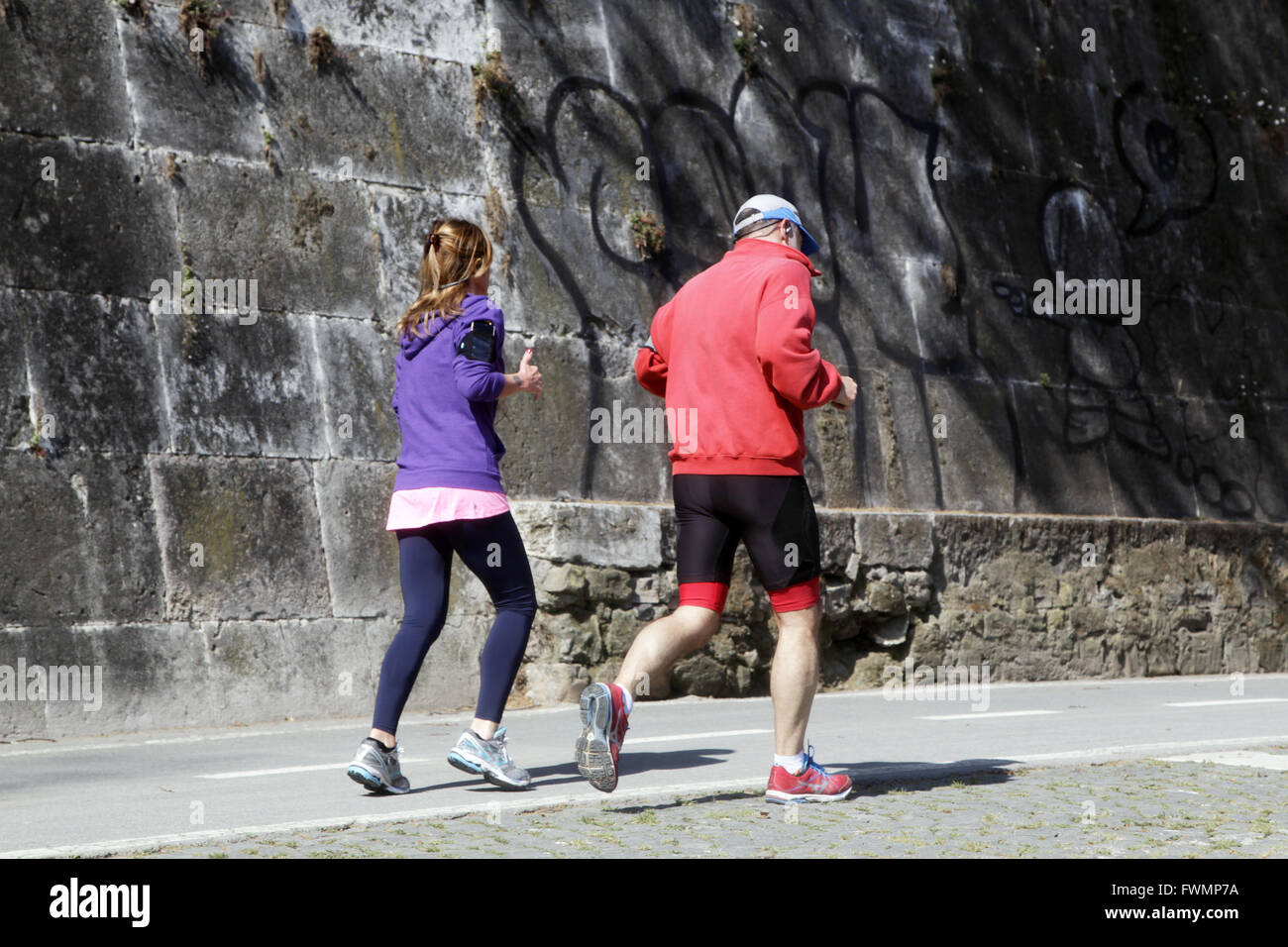 Runner on running track alongside of Tevere river in Rome, Italy Stock ...