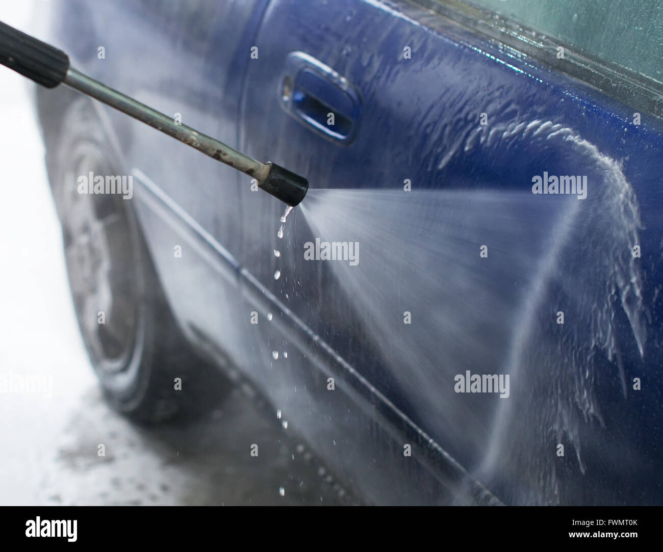 Car wash using high pressure water jet Stock Photo - Alamy