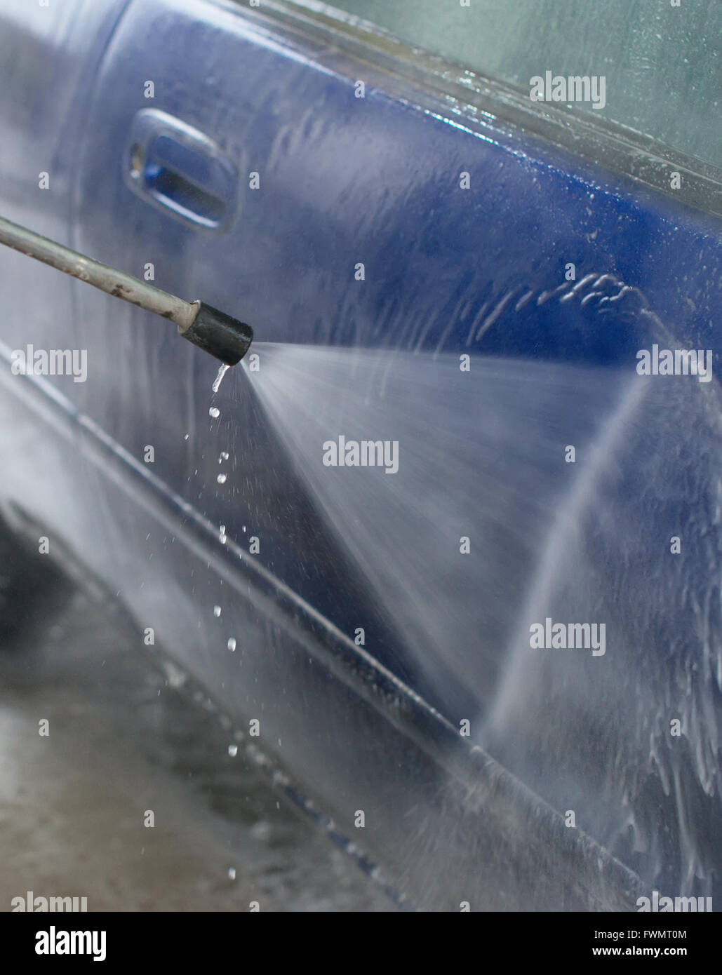 Car wash using high pressure water jet Stock Photo - Alamy