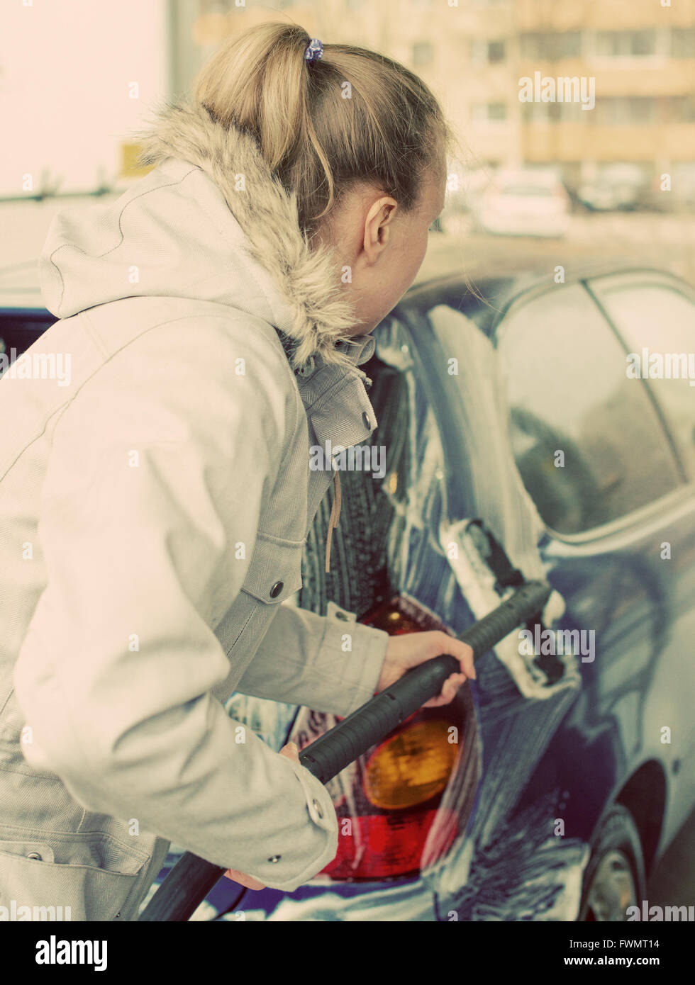 Woman washing her car at the car wash Stock Photo - Alamy