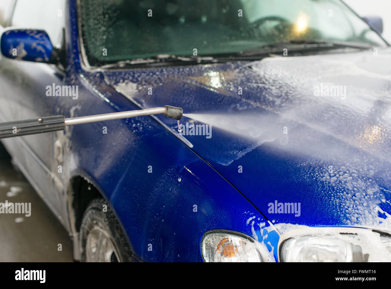 Car wash using high pressure water jet Stock Photo - Alamy