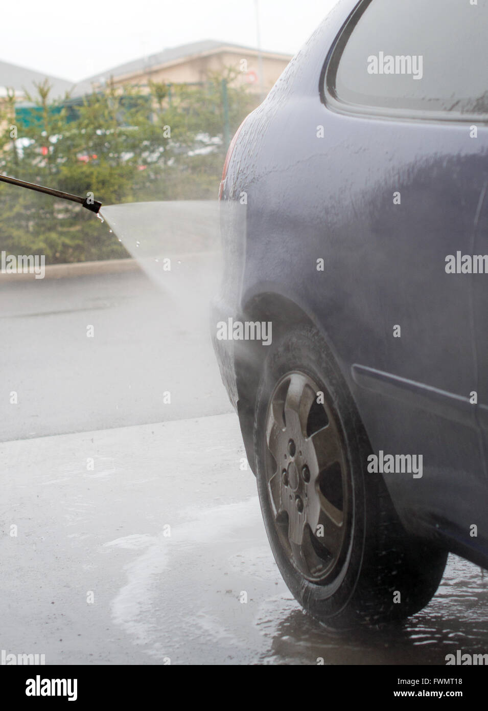 Car wash using high pressure water jet Stock Photo - Alamy