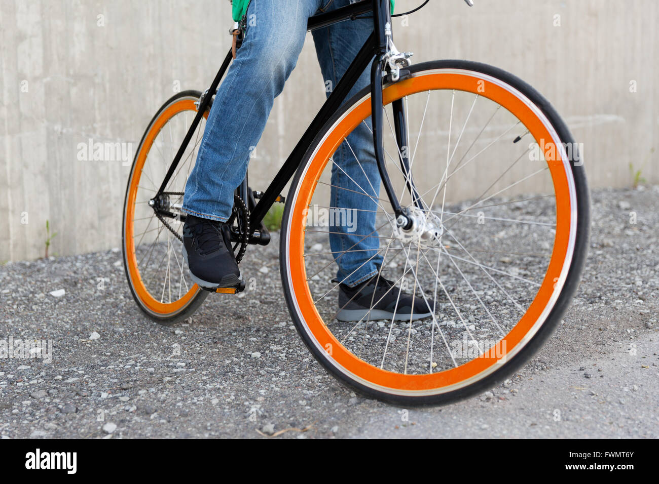 close up of man on fixed gear bike on city street Stock Photo - Alamy