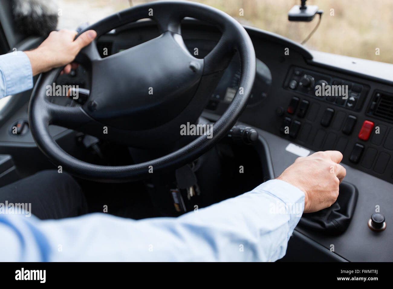 close up of driver driving passenger bus Stock Photo - Alamy